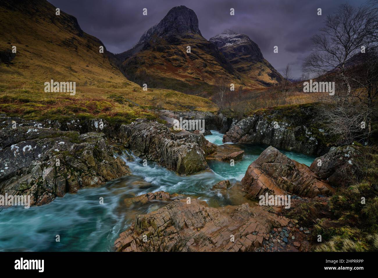 Three sisters mountains with the River Coe Rapids, Glencoe, Highlands ...