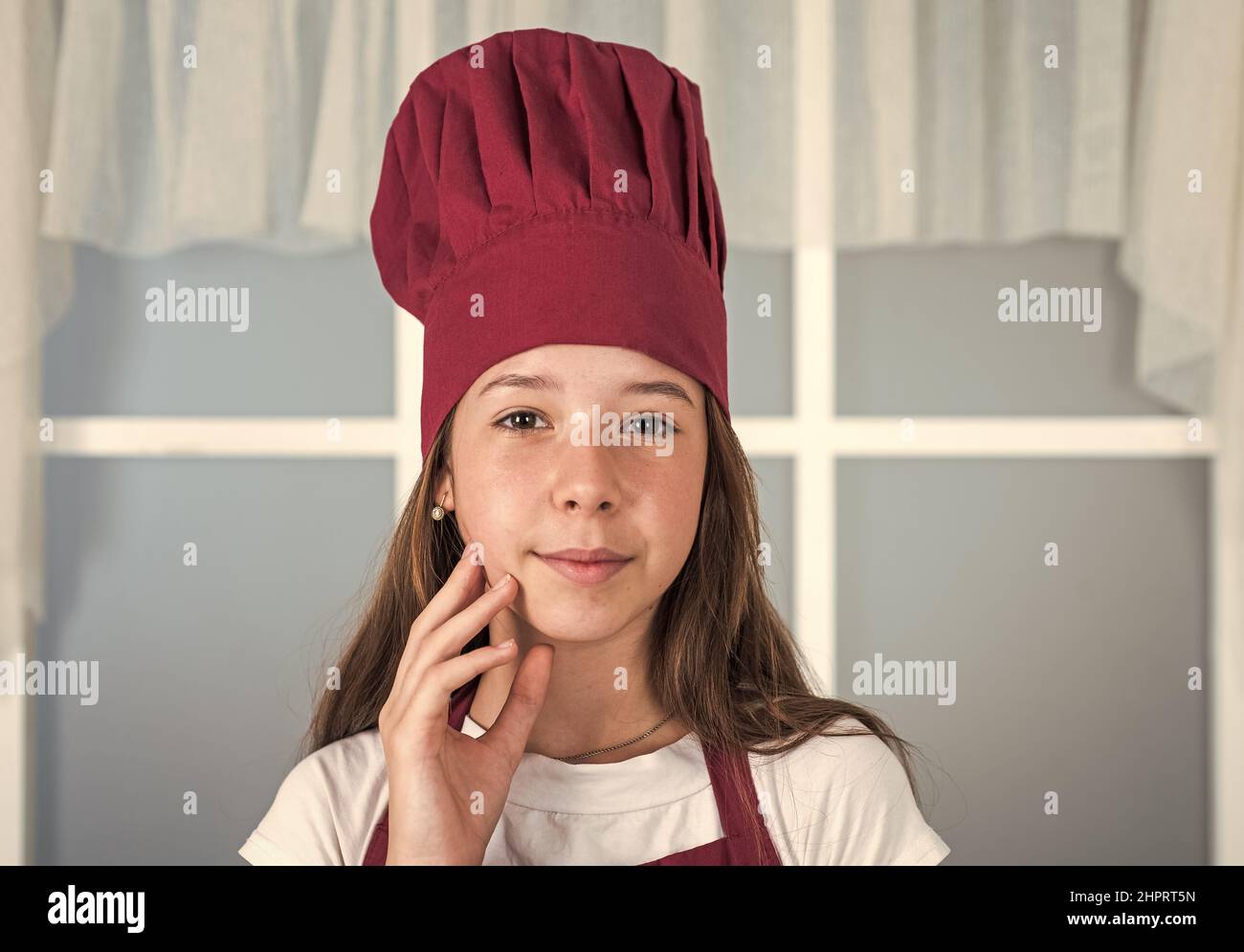 teen girl chef wearing uniform. child study how to cook by recipe. kid ...