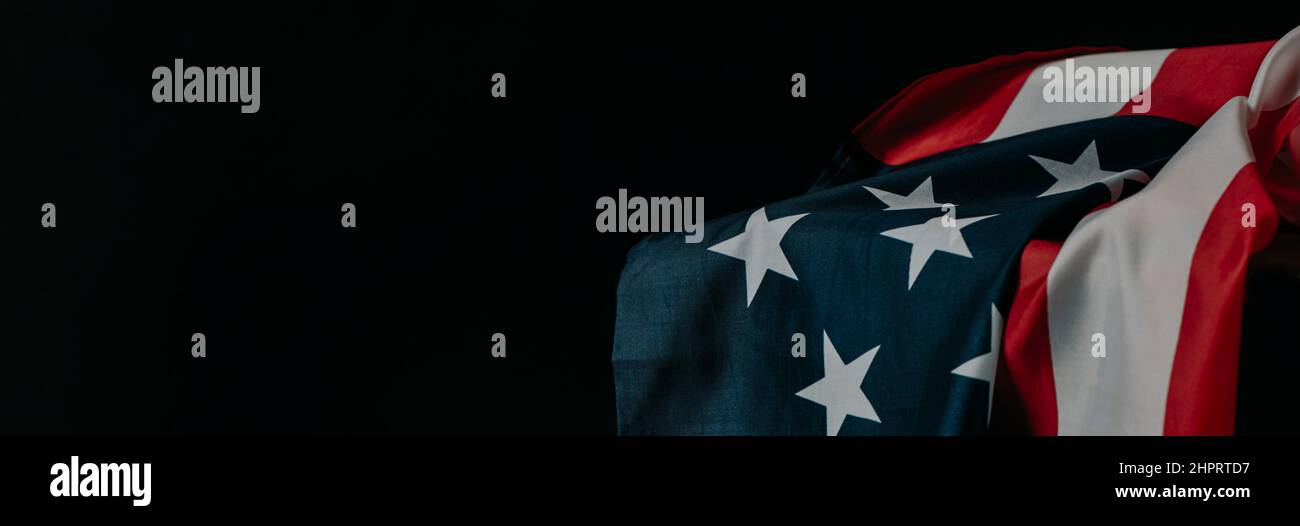 closeup of the american flag laying on a surface, with a dramatic ...