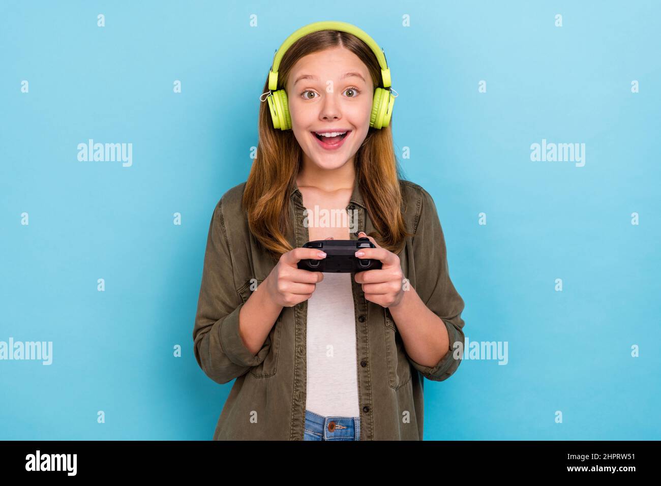 Photo of funky positive crazy cheerful little lady game addicted causal ...