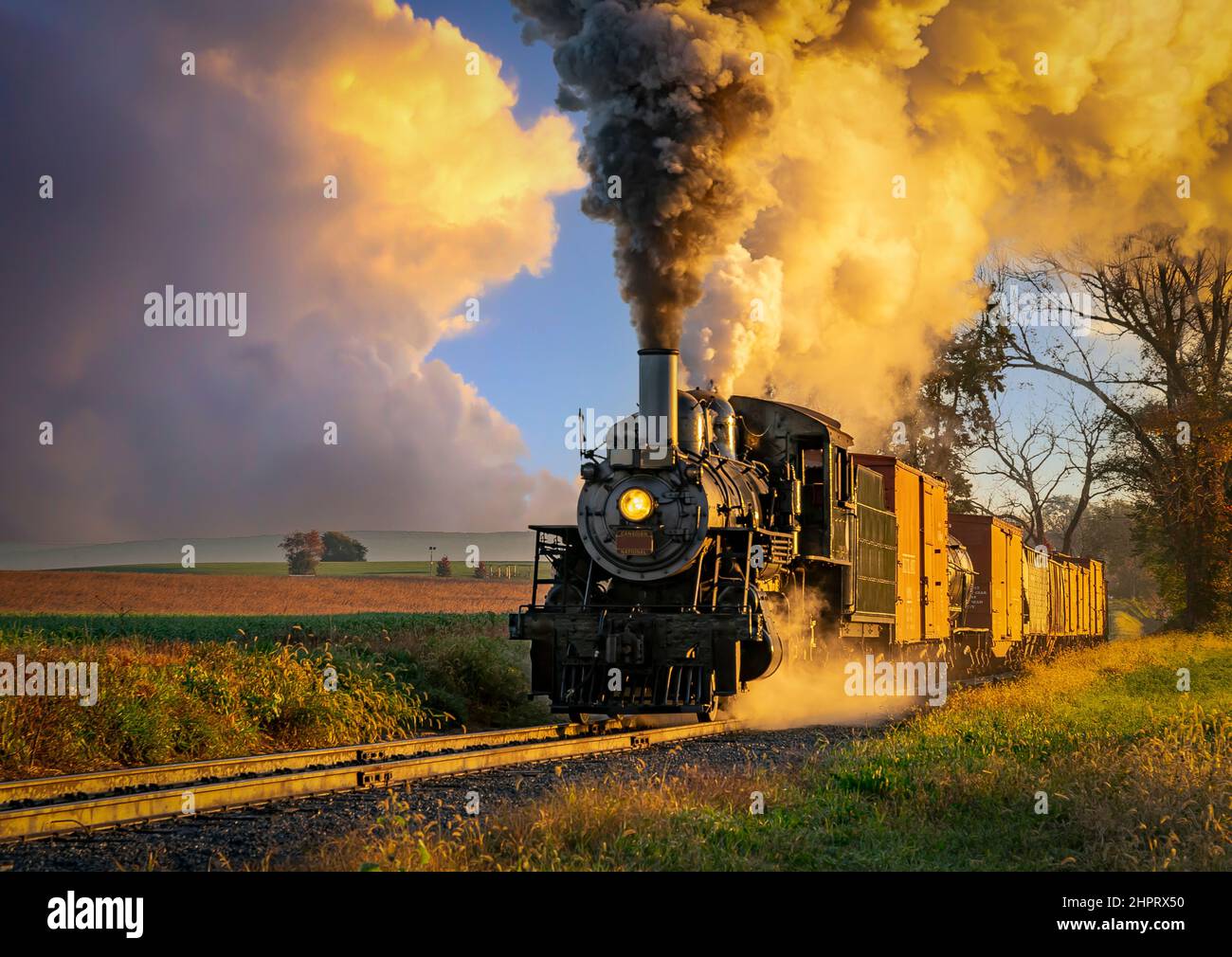 A View of an Antique Freight Steam Train Blowing Smoke Approaching Thru ...