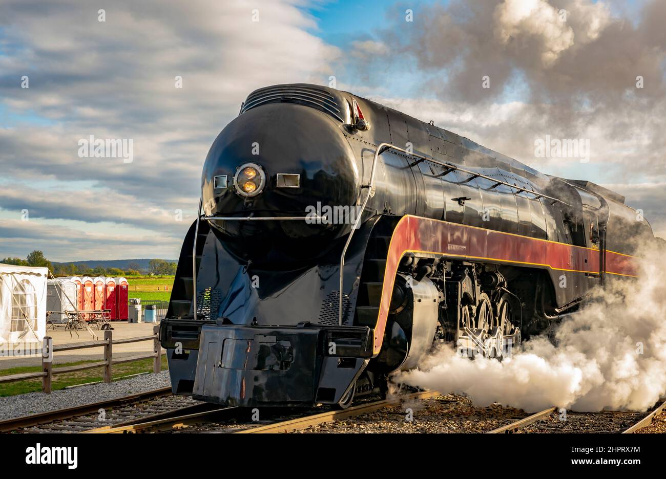 An Antique Restored Steam Engine Approaching Head-on, On Some Old Rail ...