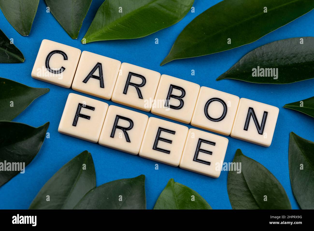 Sentence "carbon free" composed of letters. Blue background and green ...