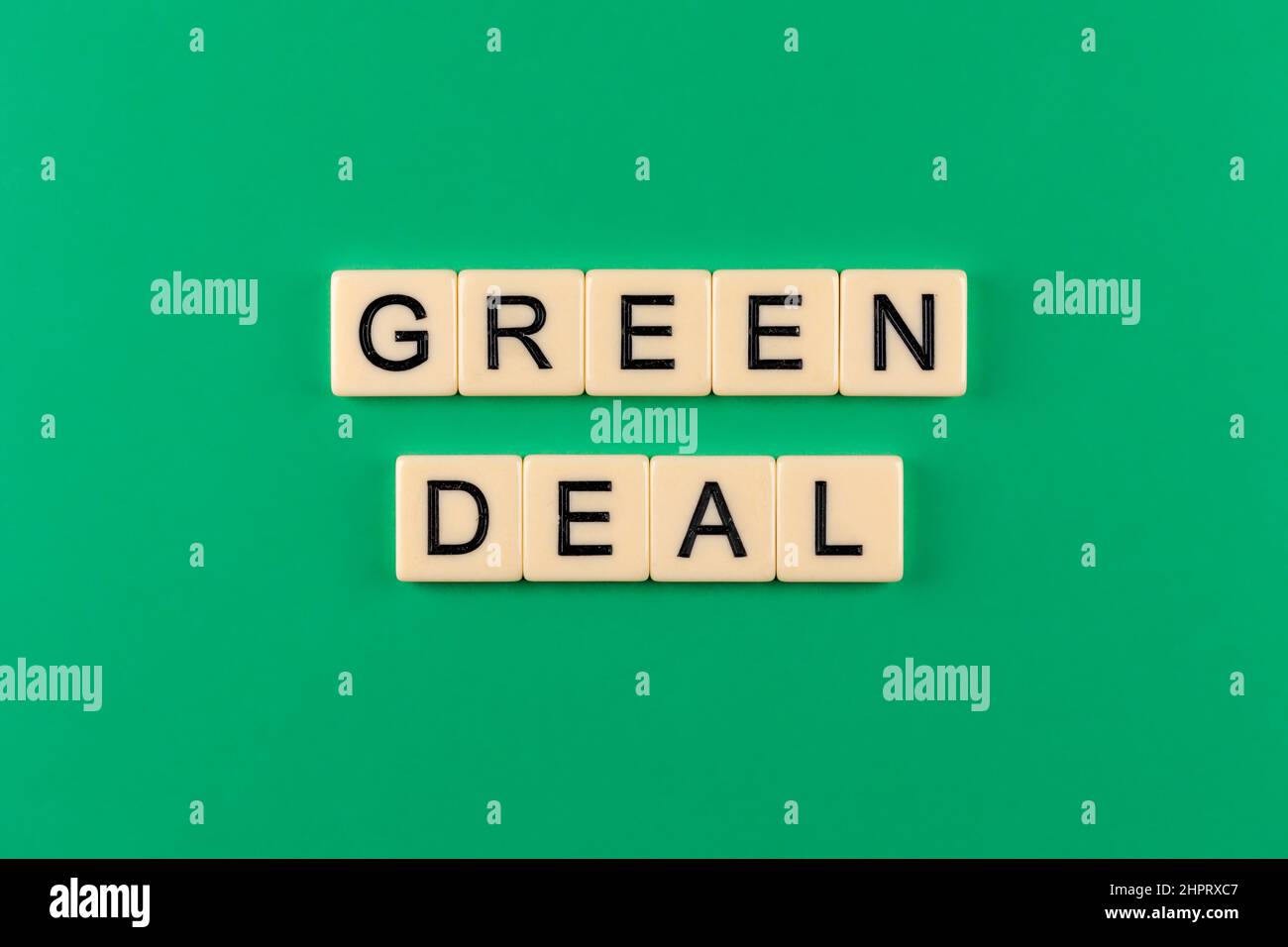 Sentence "green deal" composed of letters put on the green background ...