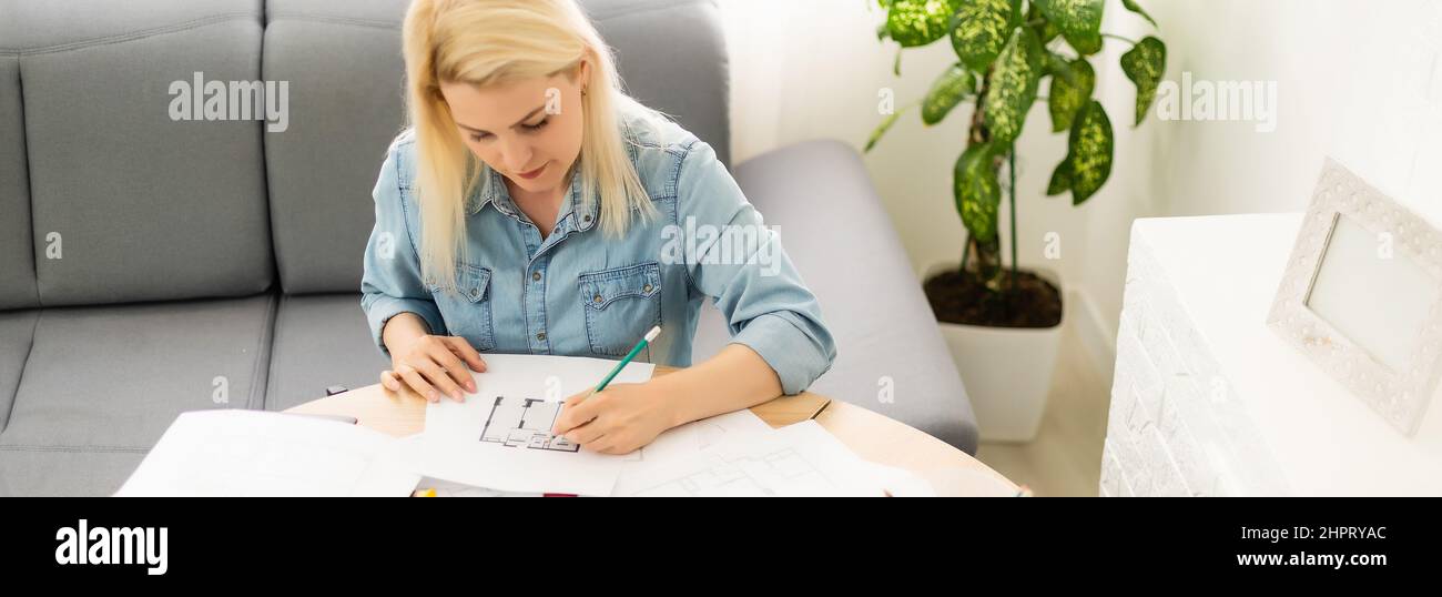 Architect working on blueprint. Architects workplace - architectural ...