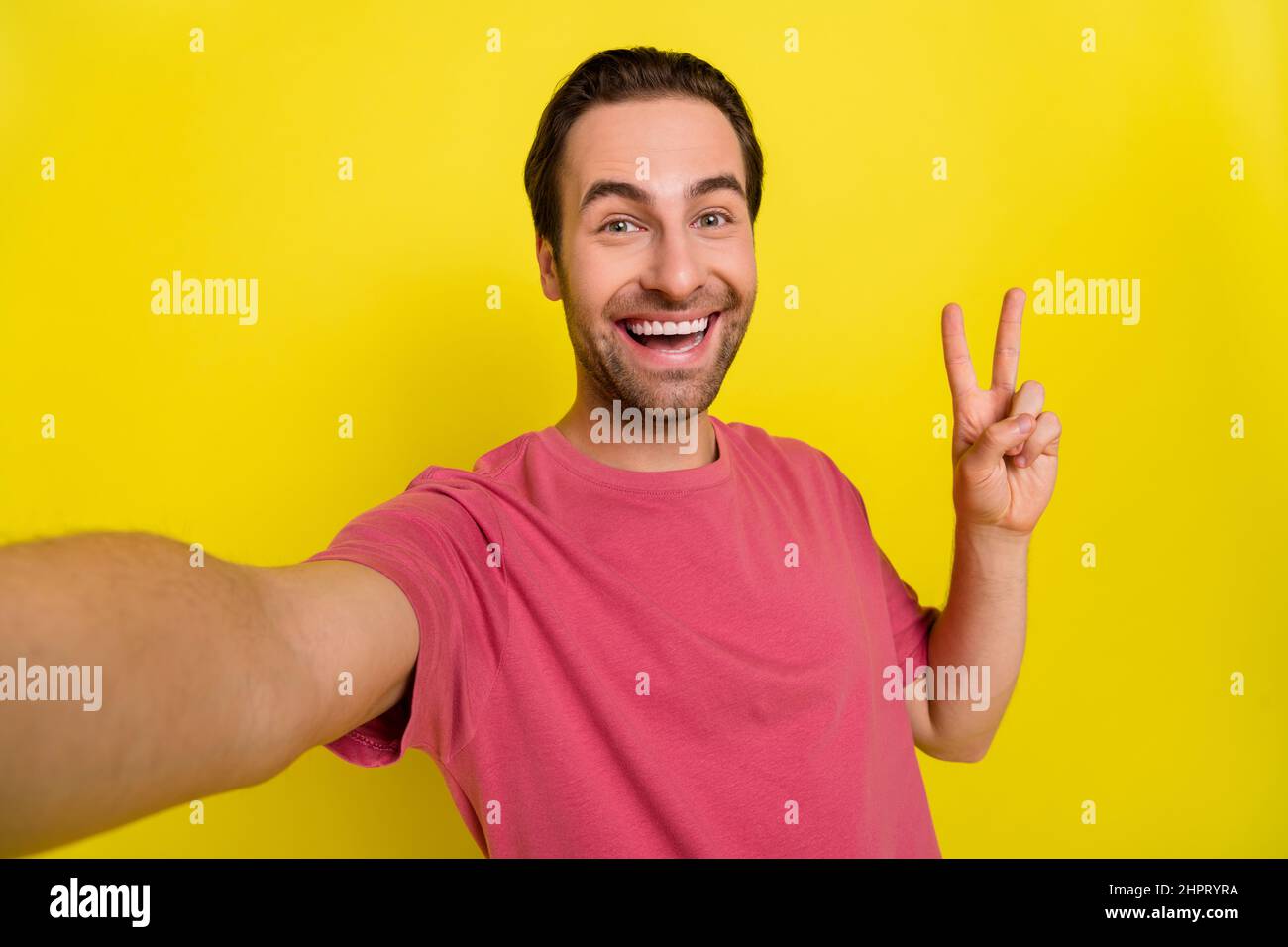 Photo of friendly crazy excited guy show v-sign take self portrait wear ...