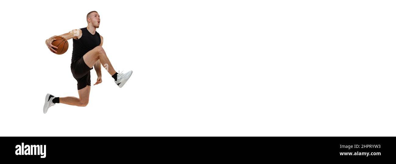 Flyer. Dynamic portrait of basketball player jumping with ball isolated ...