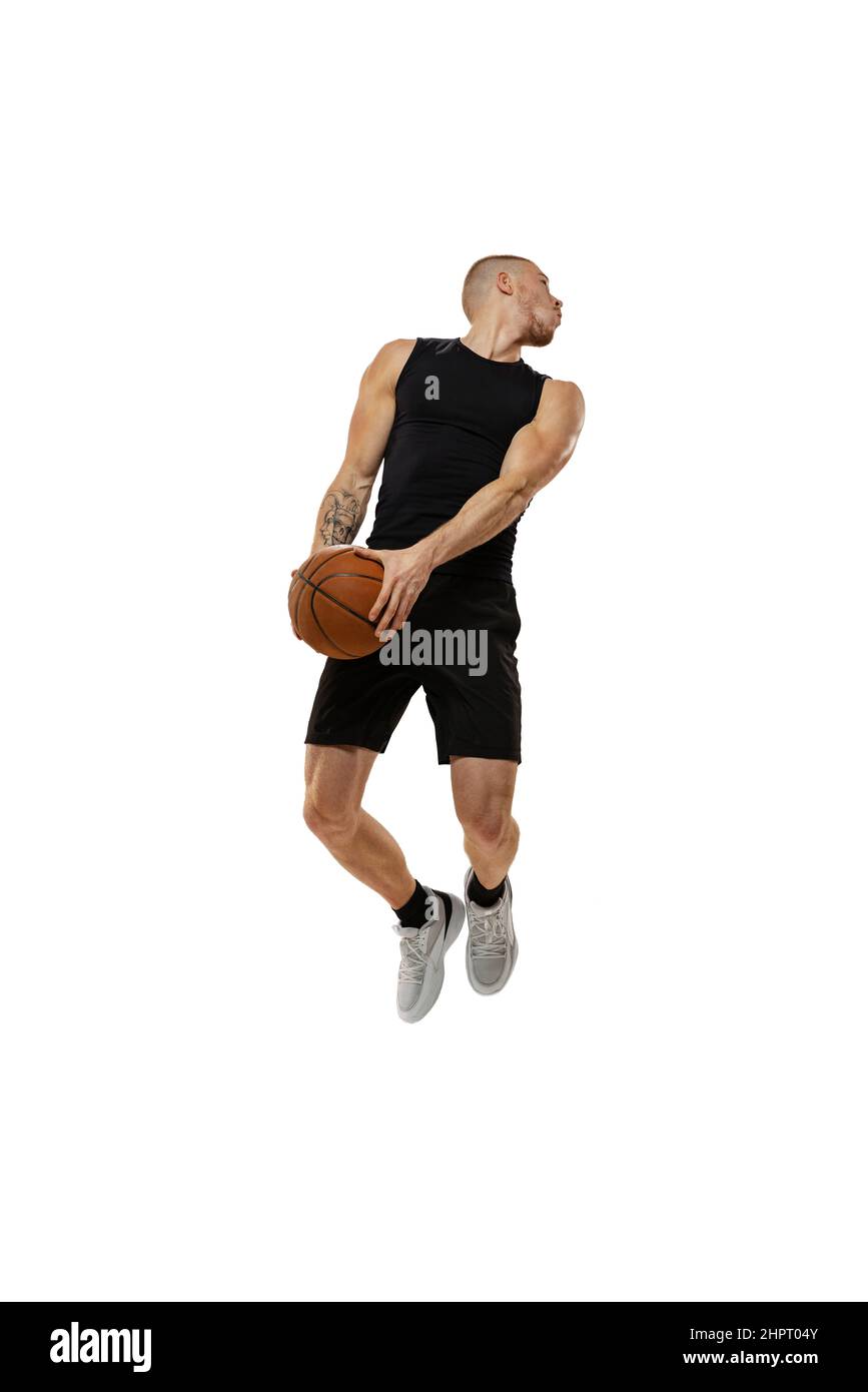 Dynamic portrait of basketball player jumping with ball isolated on ...