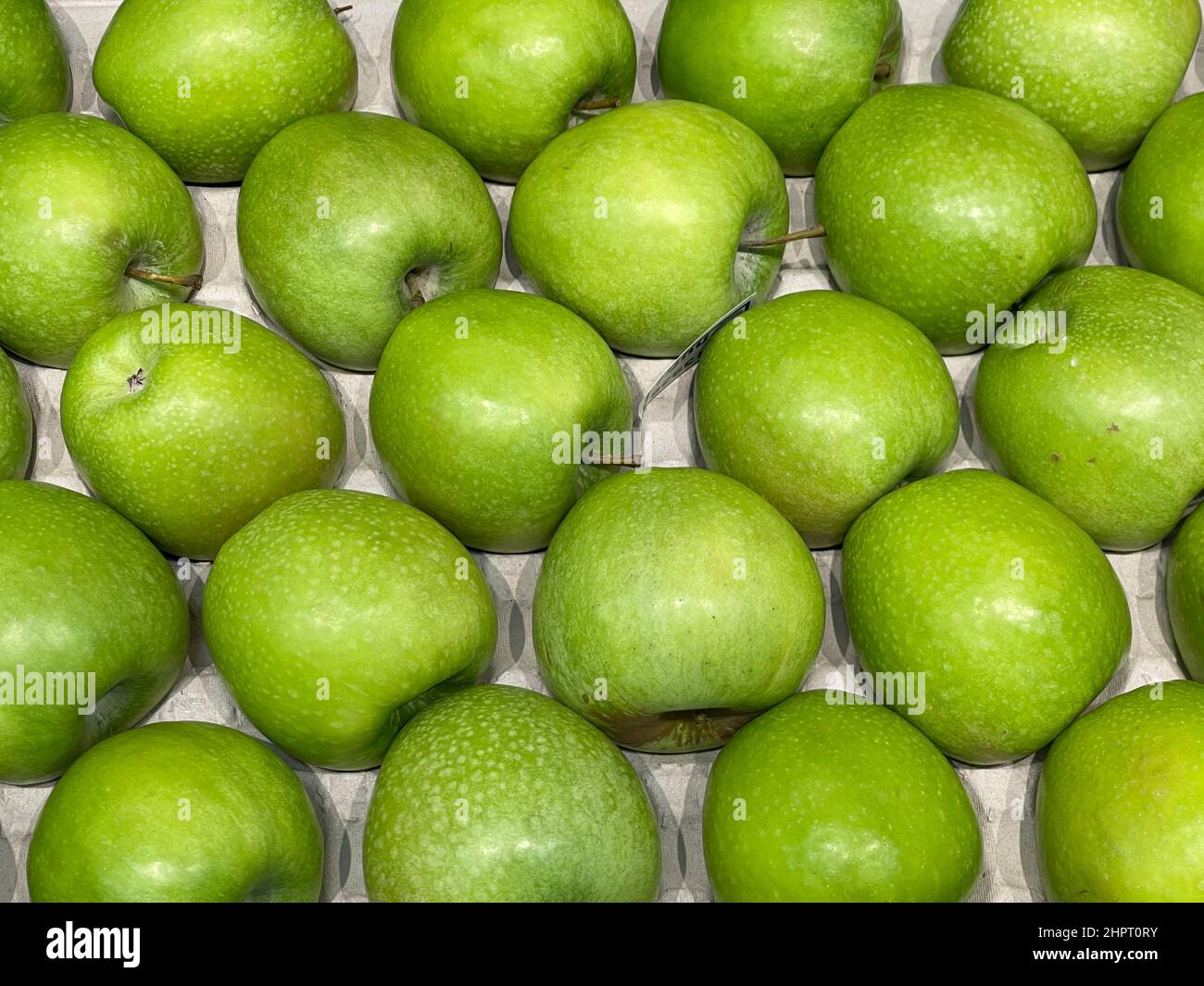 Creative layout made of green apple with watercolor spots on the white ...