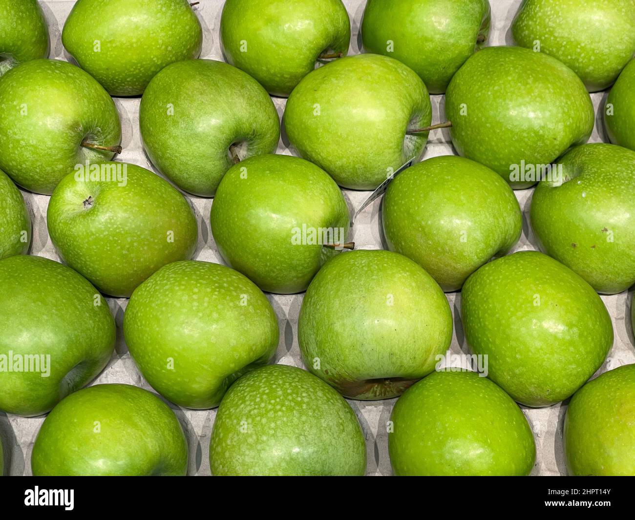 Creative layout made of green apple with watercolor spots on the white ...