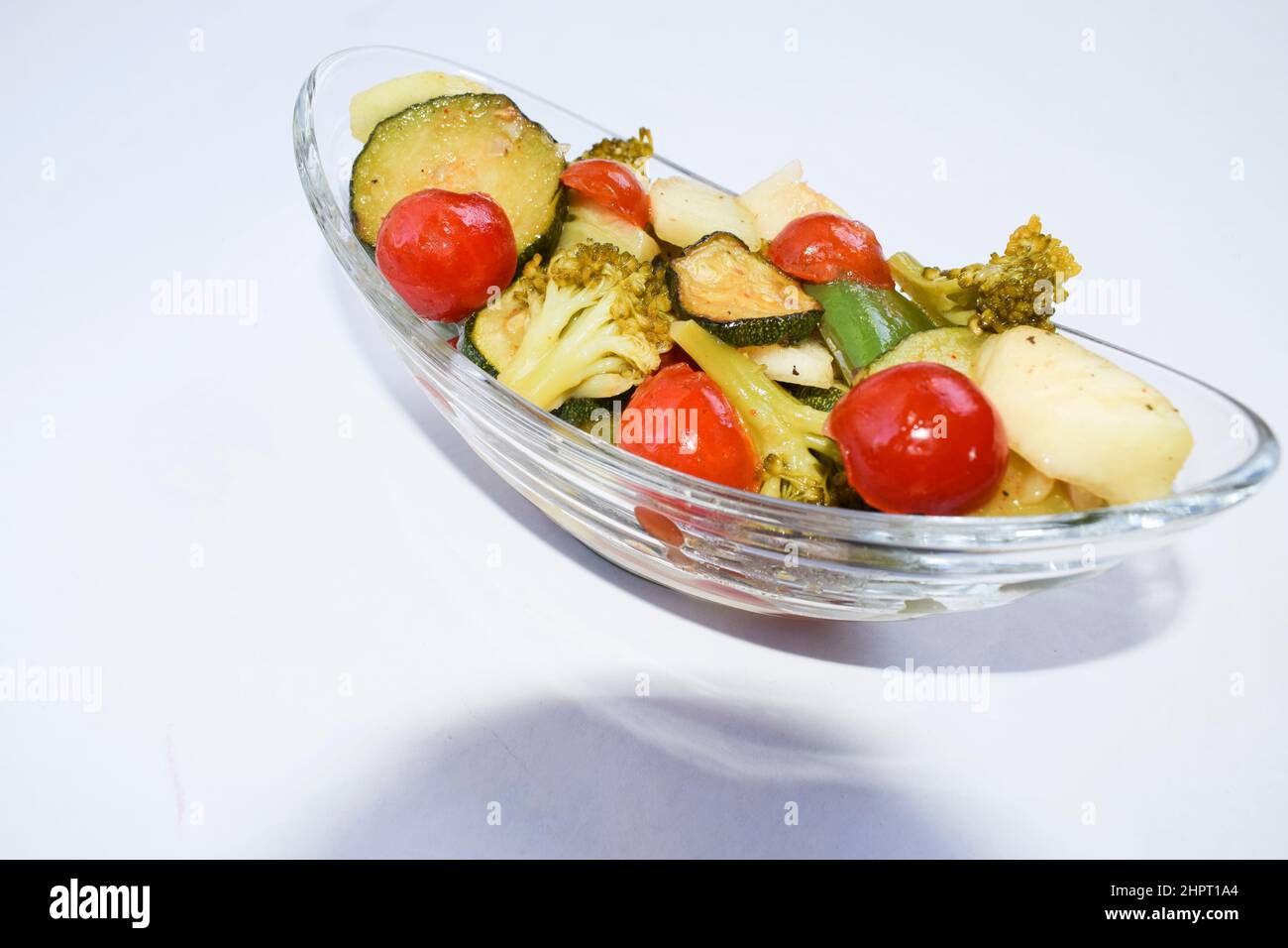 Fresh homemade salad made with red cherry tomato, broccoli, peach ...