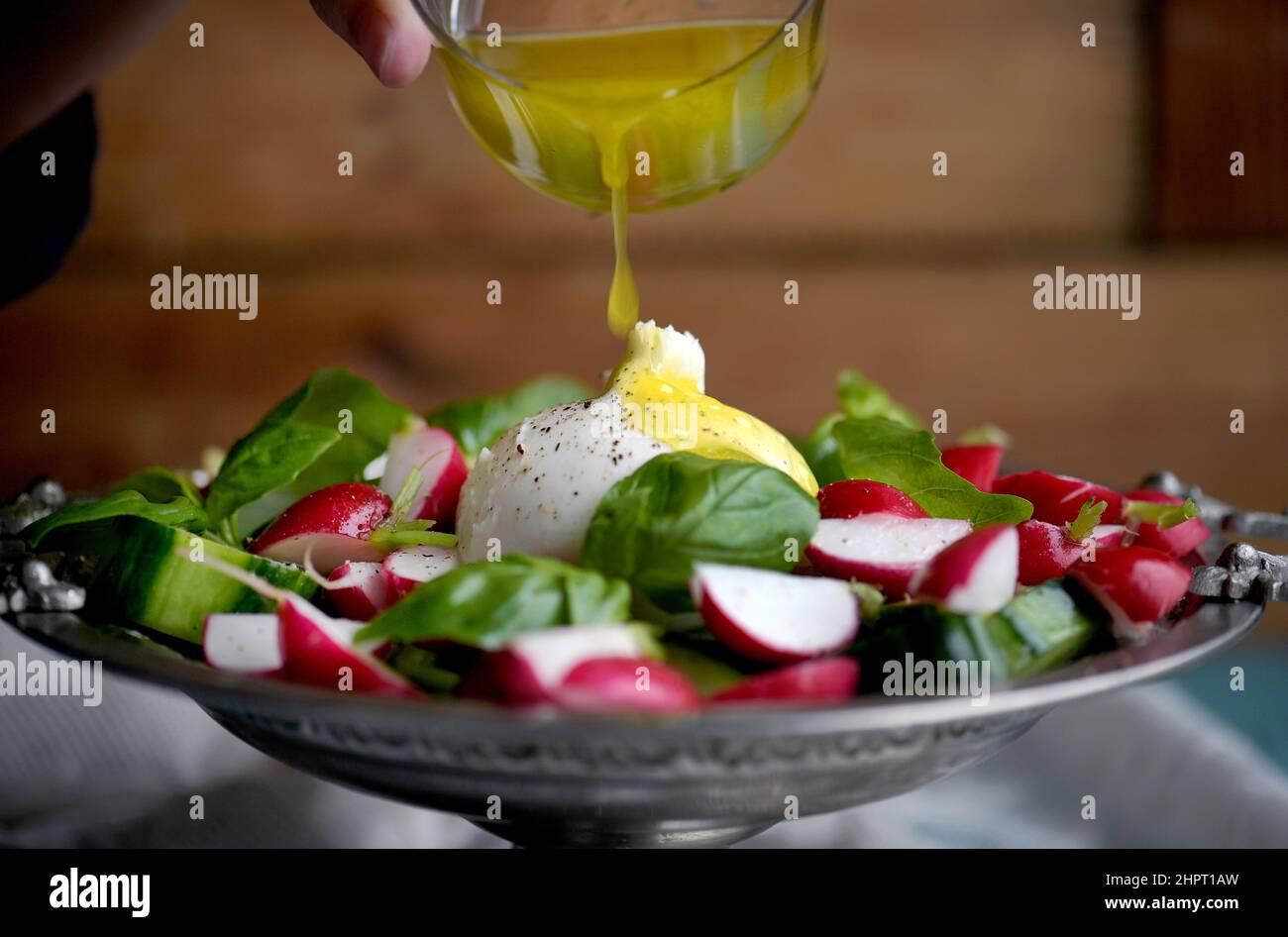 Burrata, olive oil and radish salad with basil, lime and cucumber Photo ...