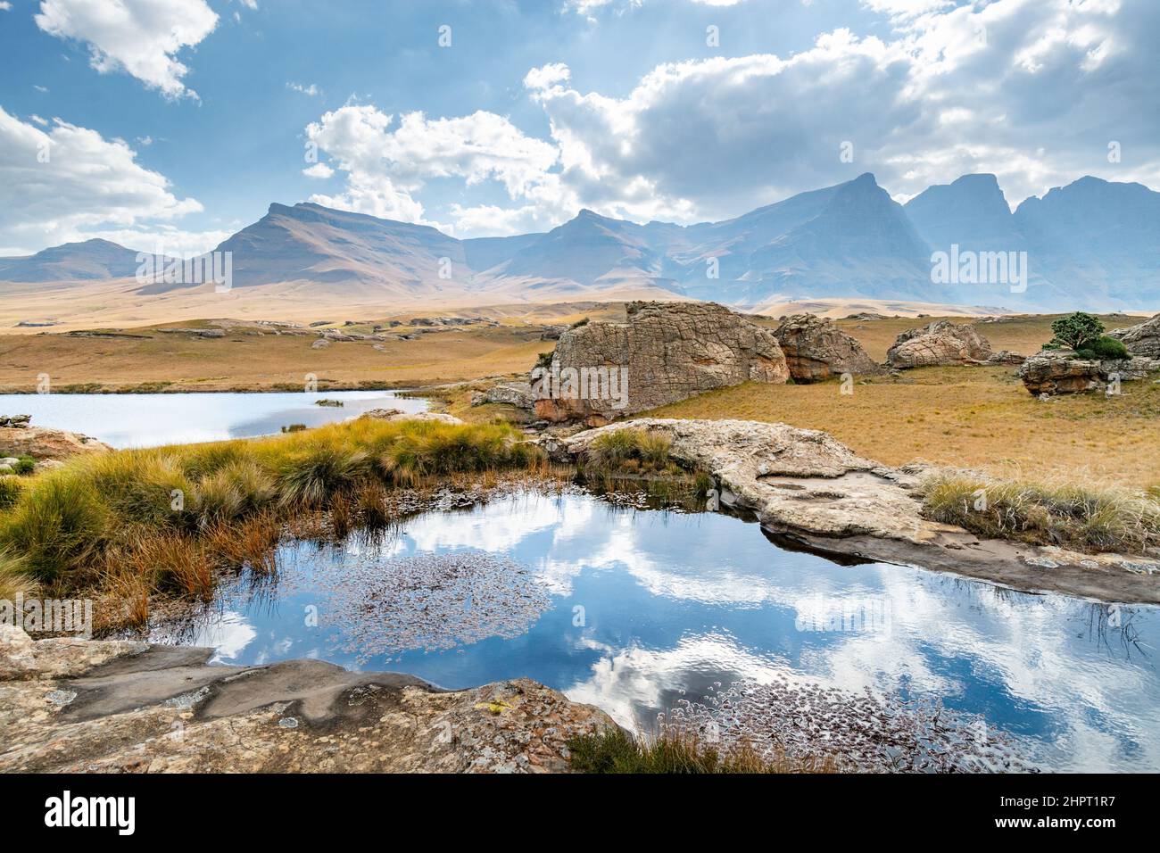 Travel to Lesotho. Ponds, grassland and rock formations and hills of ...