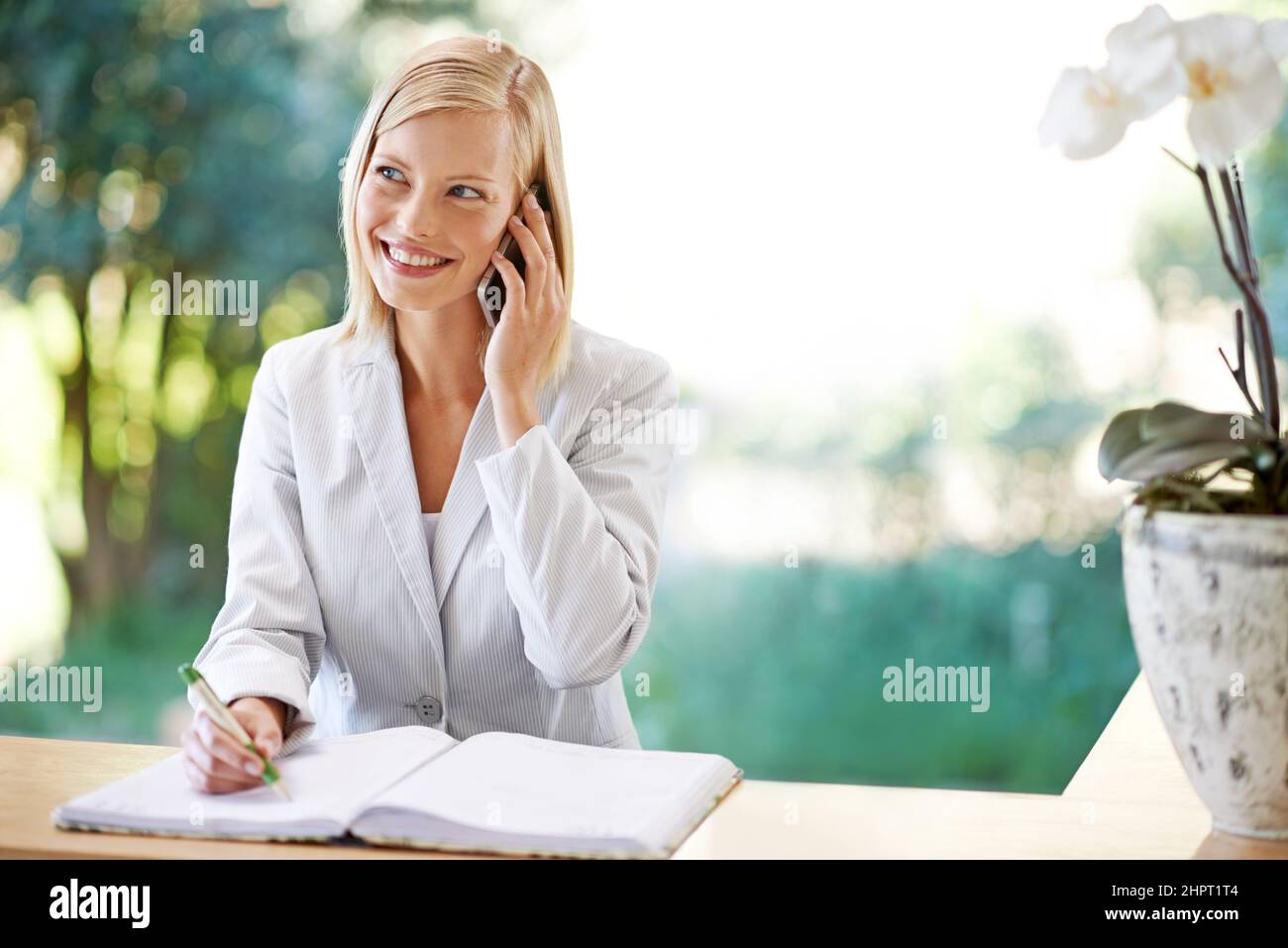 Attractive blonde secretary sitting desk hi-res stock photography and ...