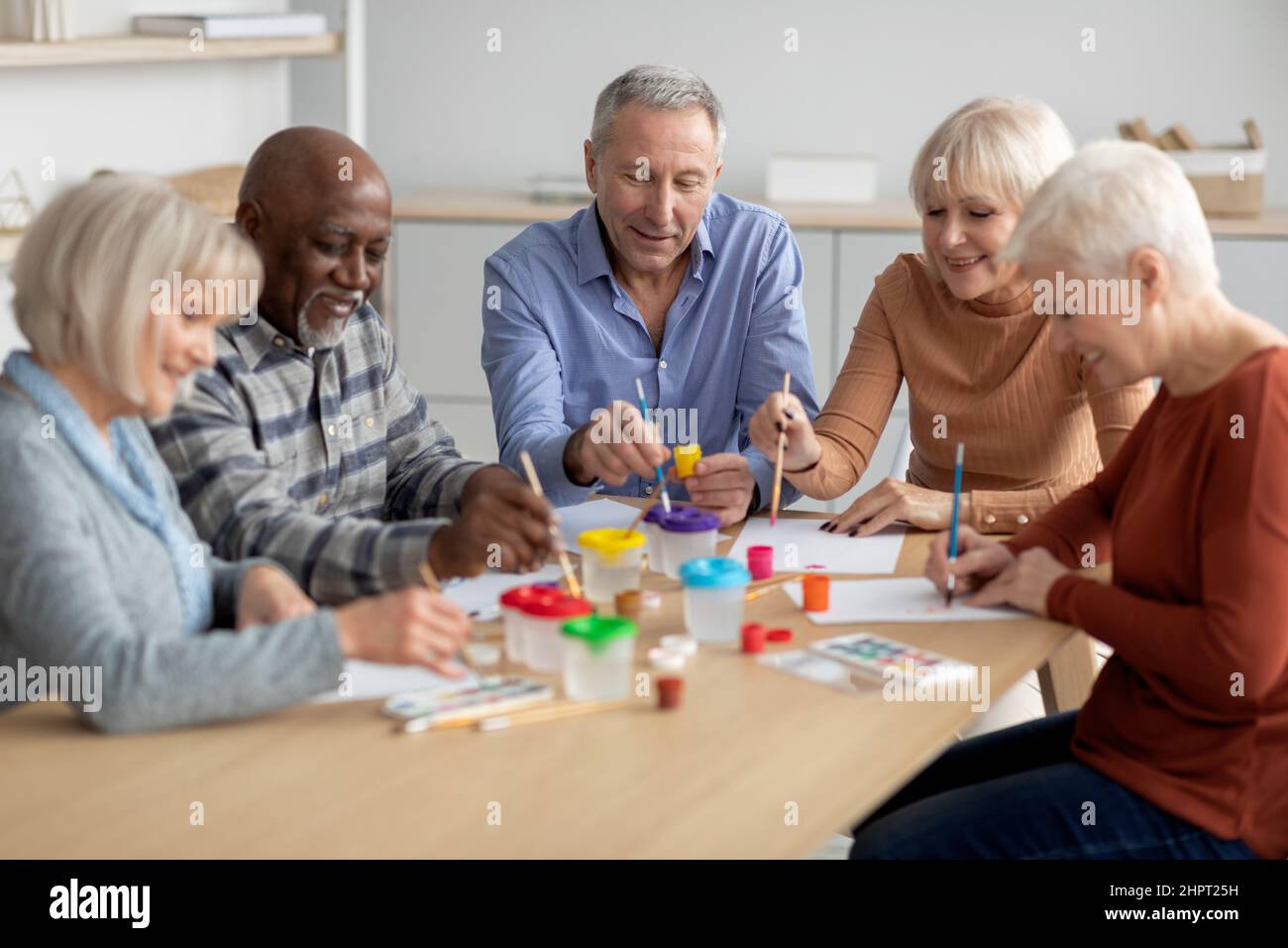 Multiethnic group of senior people having painting activity Stock Photo ...