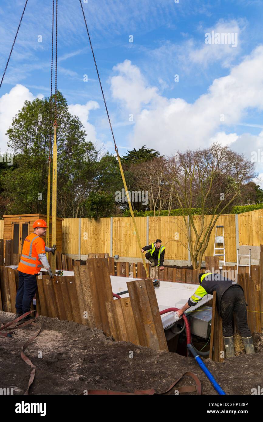 Swimming pool installation - lowering the pool into position Stock ...