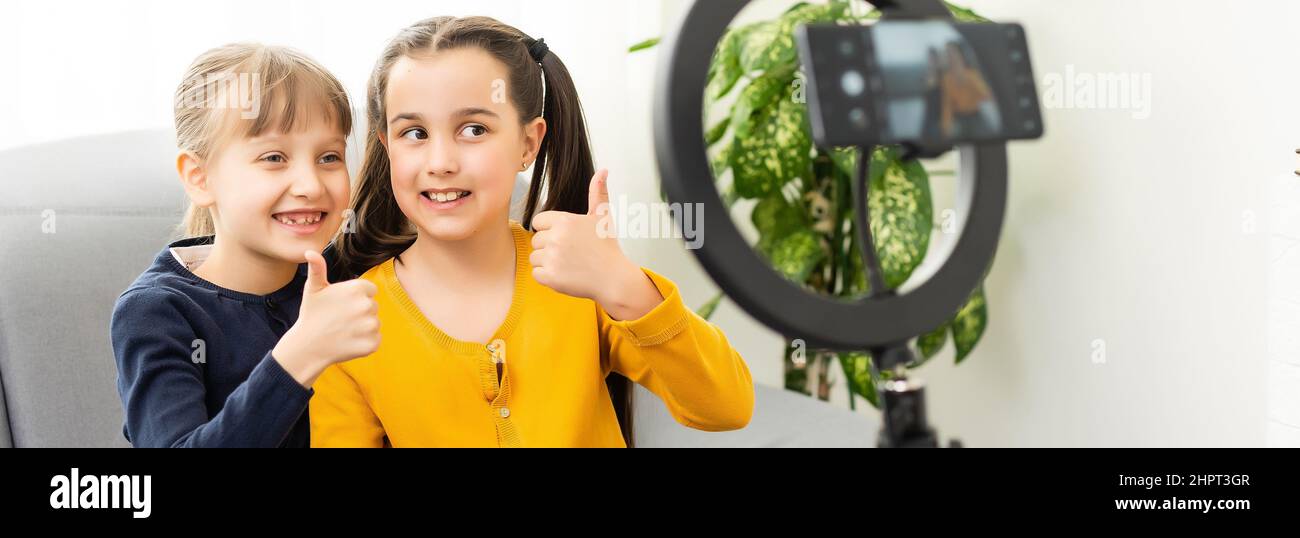 Close up photo two little girls take selfies, talk, tell, speak Stock ...