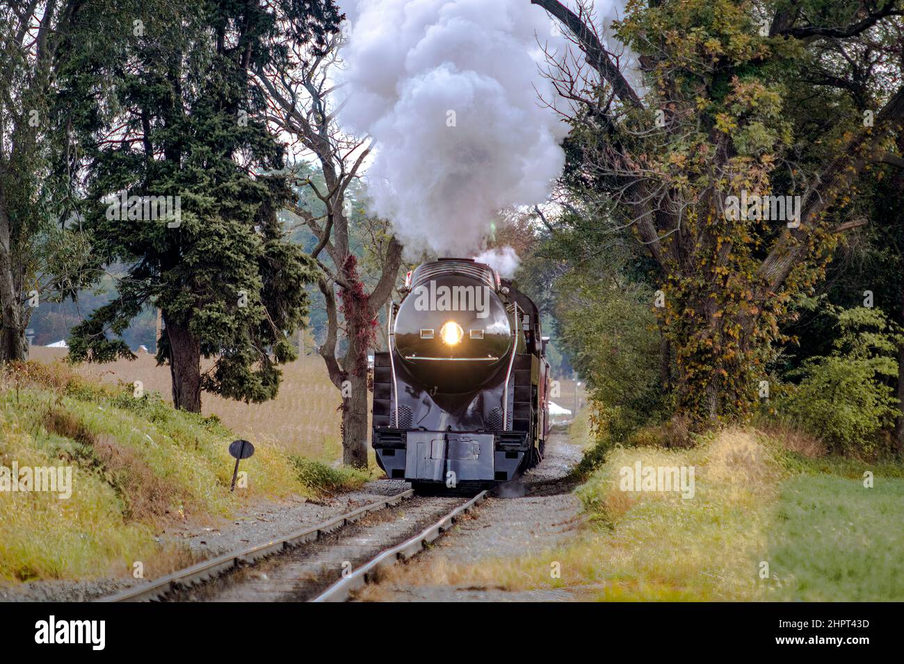 An Antique Restored Steam Engine Approaching Head-on, On Some Old Rail ...