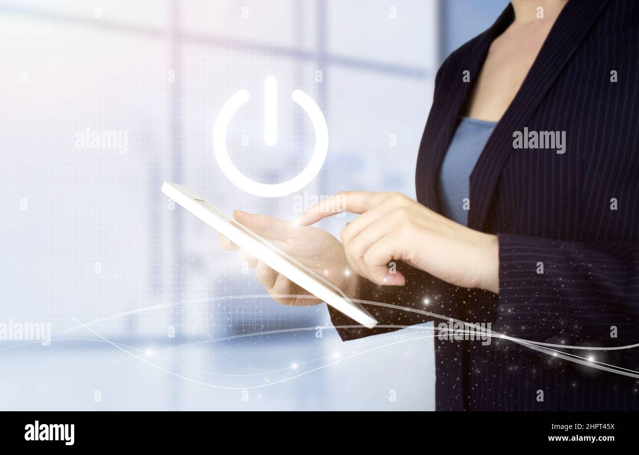 Start or shut down concept. Hand touch white tablet with digital ...