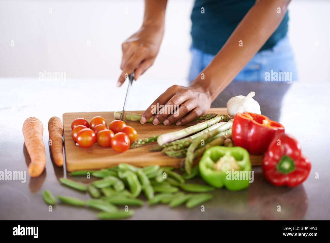 Preparing a healthy and wholesome meal. Cropped closeup shot of a woman ...