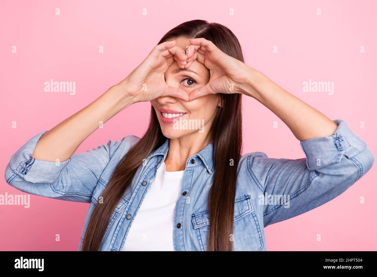 Photo of young cheerful lady show arms heart symbol cupid romance ...