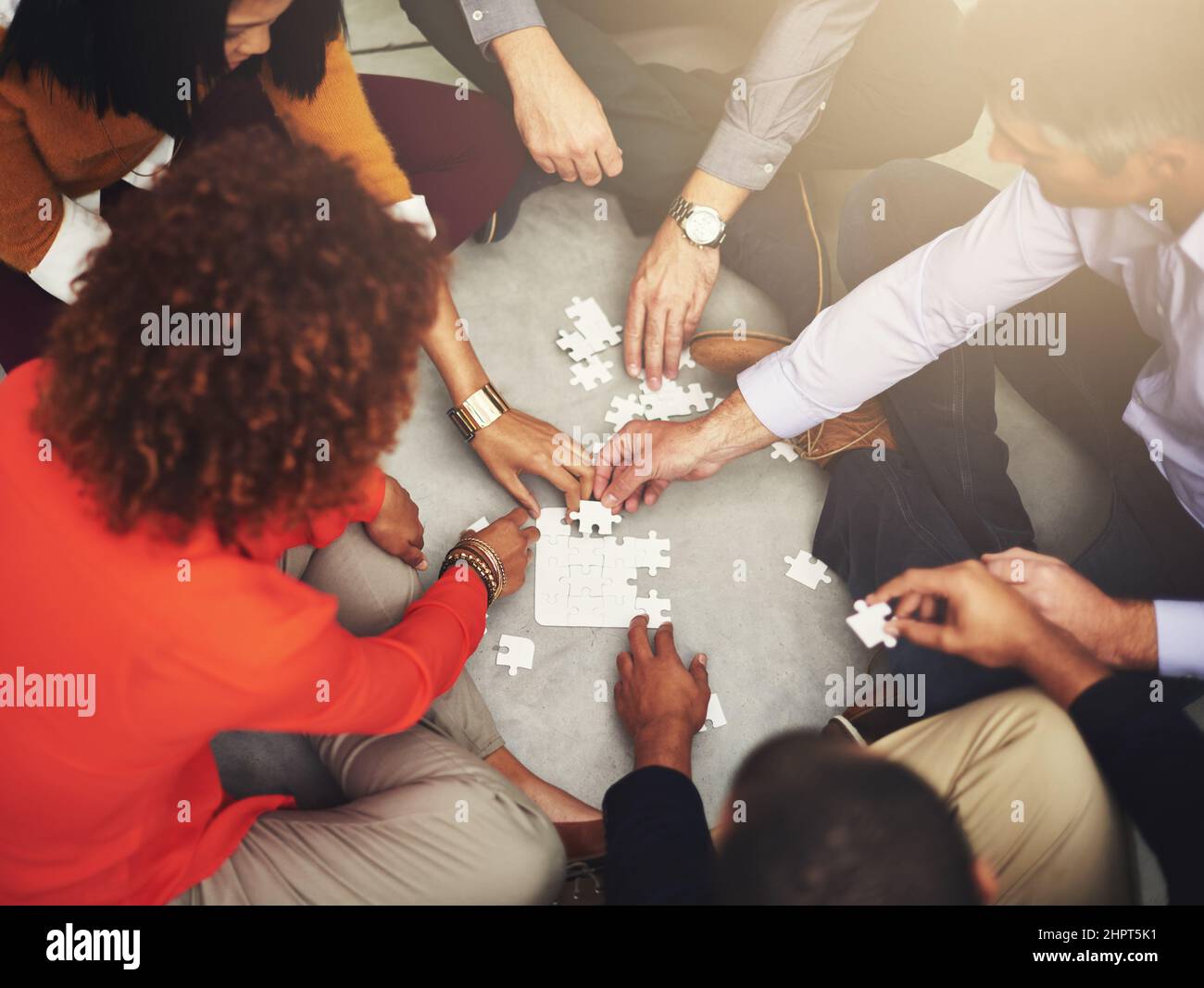 Putting a puzzle together hi-res stock photography and images - Alamy