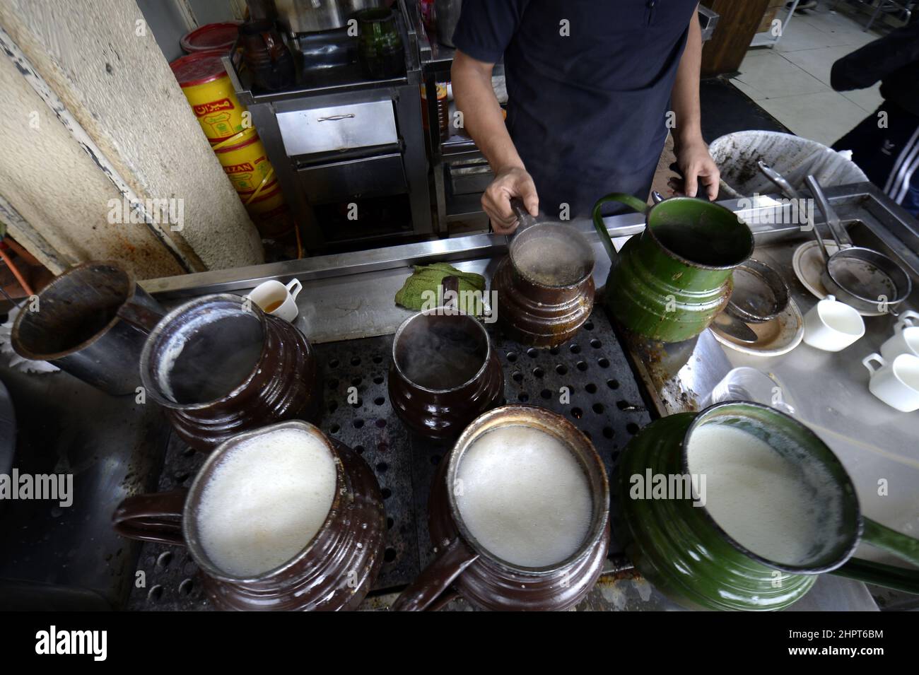 Islamabad, Pakistan. 23rd Feb, 2022. A man makes milk tea at a milk tea ...