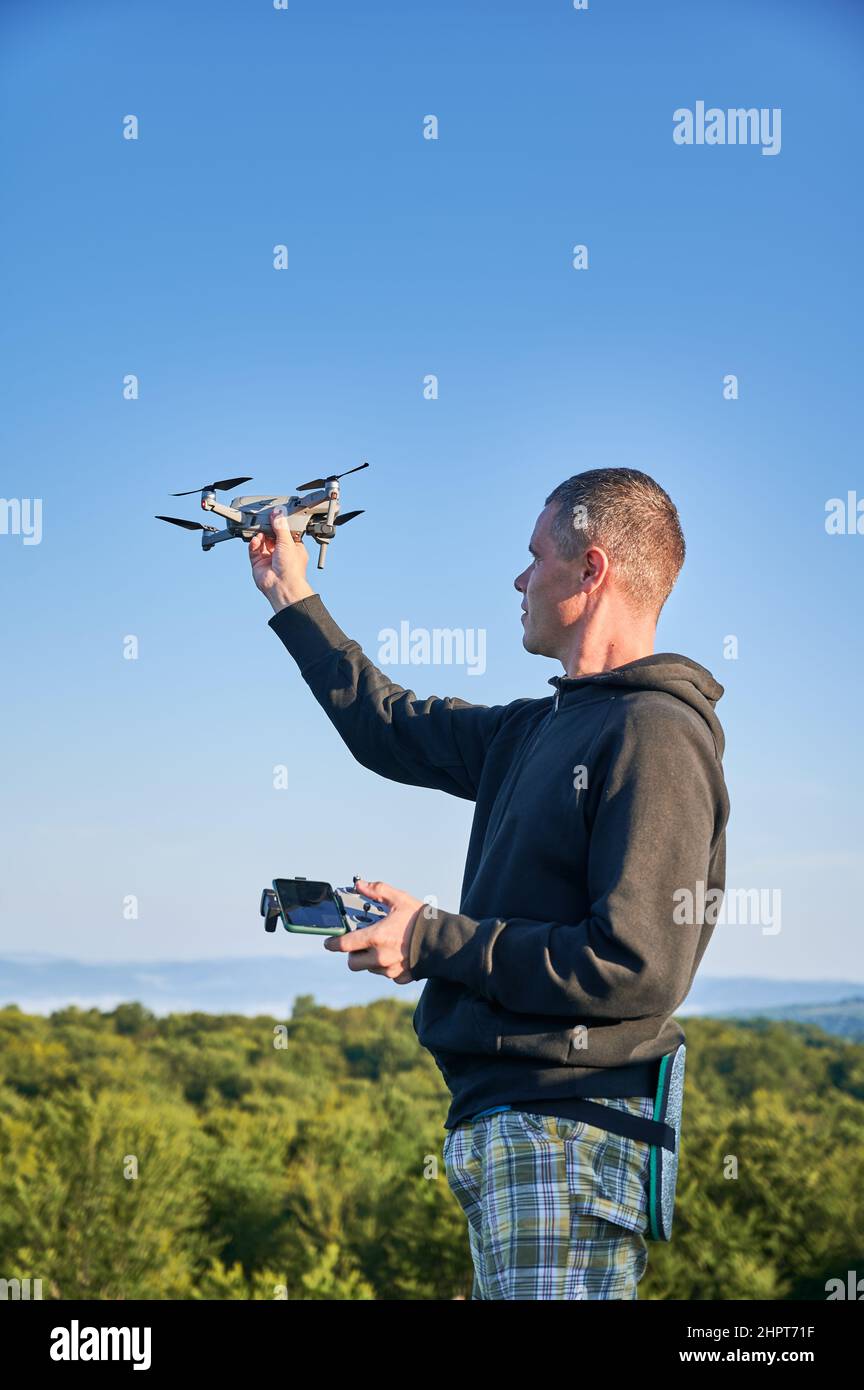 Man control drone shooting mountain hi-res stock photography and images ...