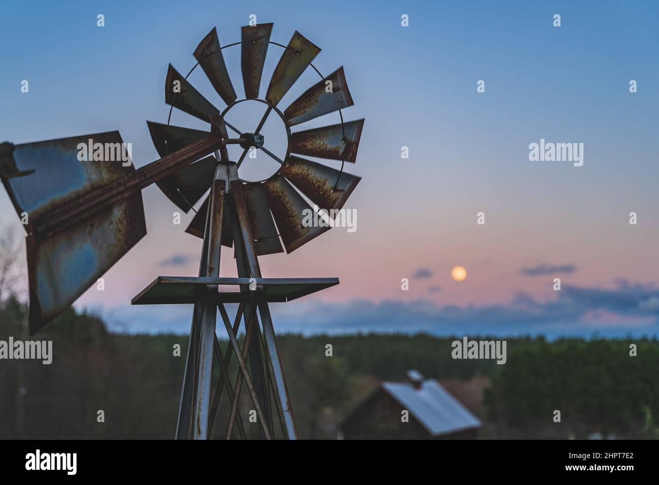 Dramatic Evening sky with yellow moon rising windmill silhouette ...