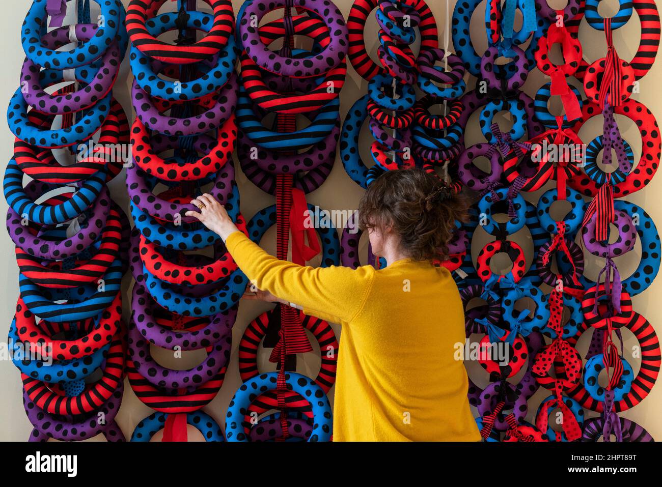 London, UK. 23 February 2022. Textile artist Anna Ray with her work ...