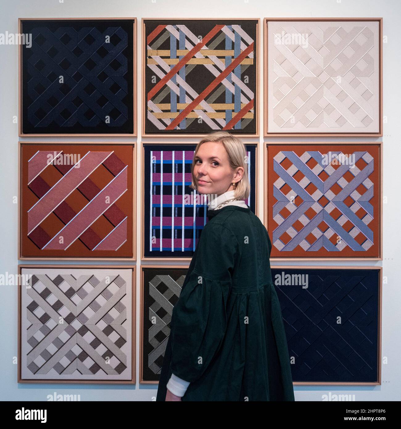 London, UK. 23 February 2022. Artist Amelia Ayerst with her works made ...