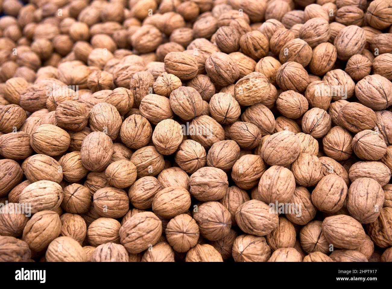 Large group of wallnut fruit background Stock Photo - Alamy