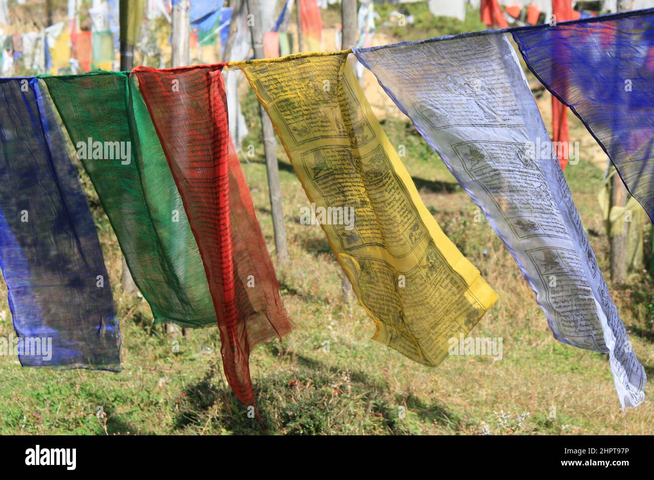 buddhist banners and prayer flags in bhutan Stock Photo - Alamy