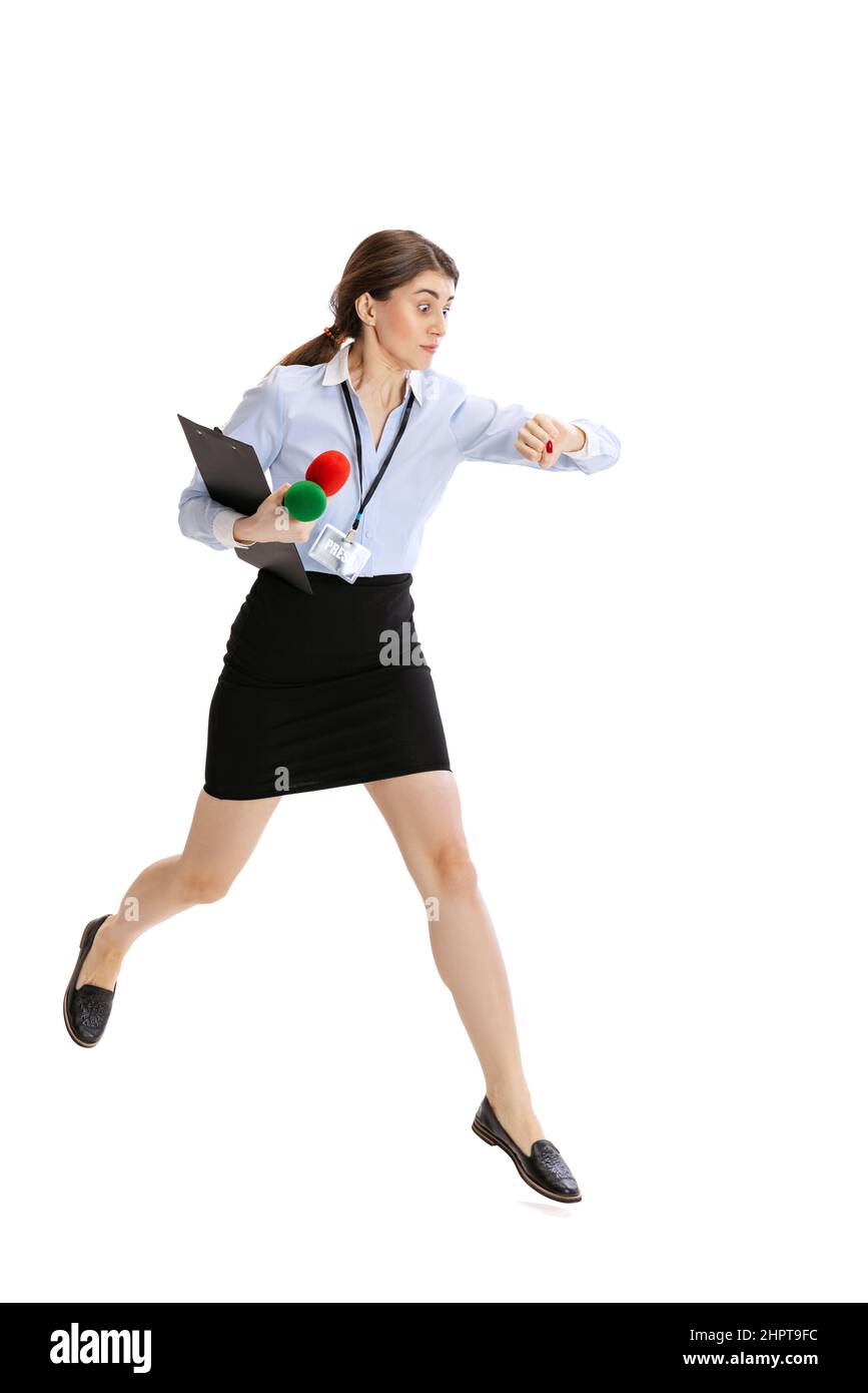 Be late for an interview. Female journalist holding reporter microphone ...
