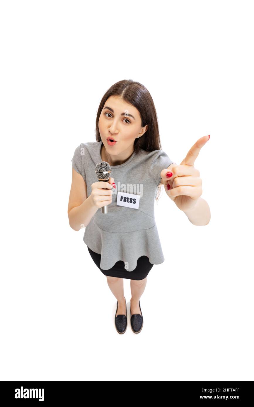 Ideas. High angle view of emotional young girl, female journalist ...