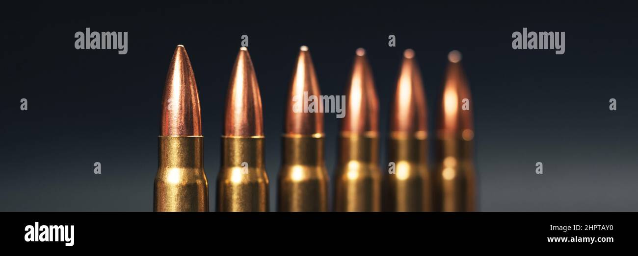 Bullets on gray background banner. Cartridges 7.62 caliber for ...