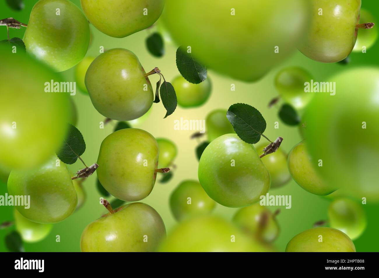 Fruits falling down on green background Stock Photo - Alamy