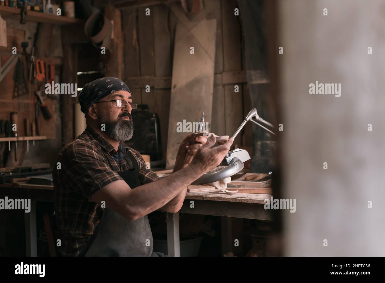 Carpenter making wooden spoon hi-res stock photography and images - Alamy