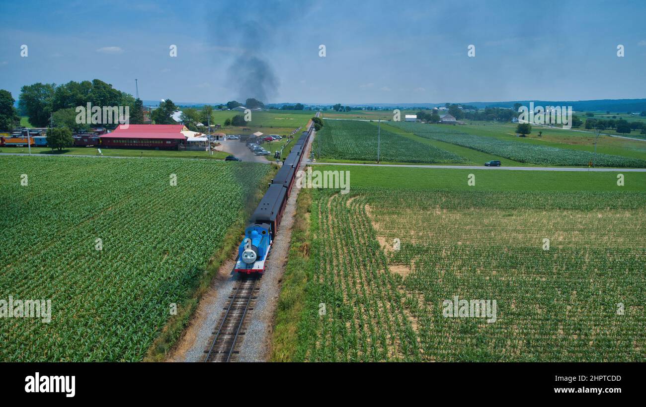 Aerial view of Thomas the Tank Engine going through the farmland Stock ...
