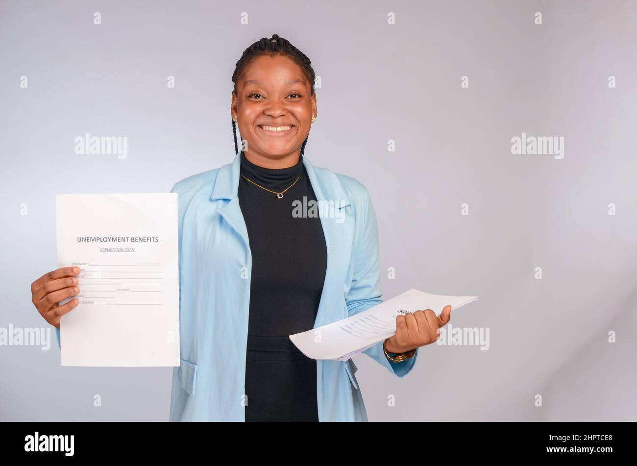 Beautiful African travel agent holding a travel visa application form ...