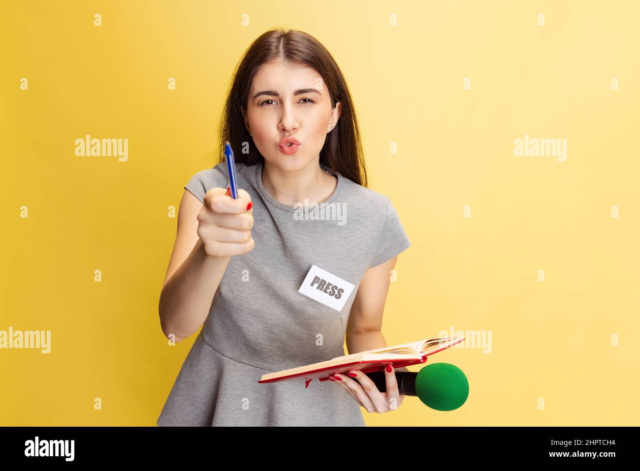 Emotional young girl, female reporter holding reporter microphone ...