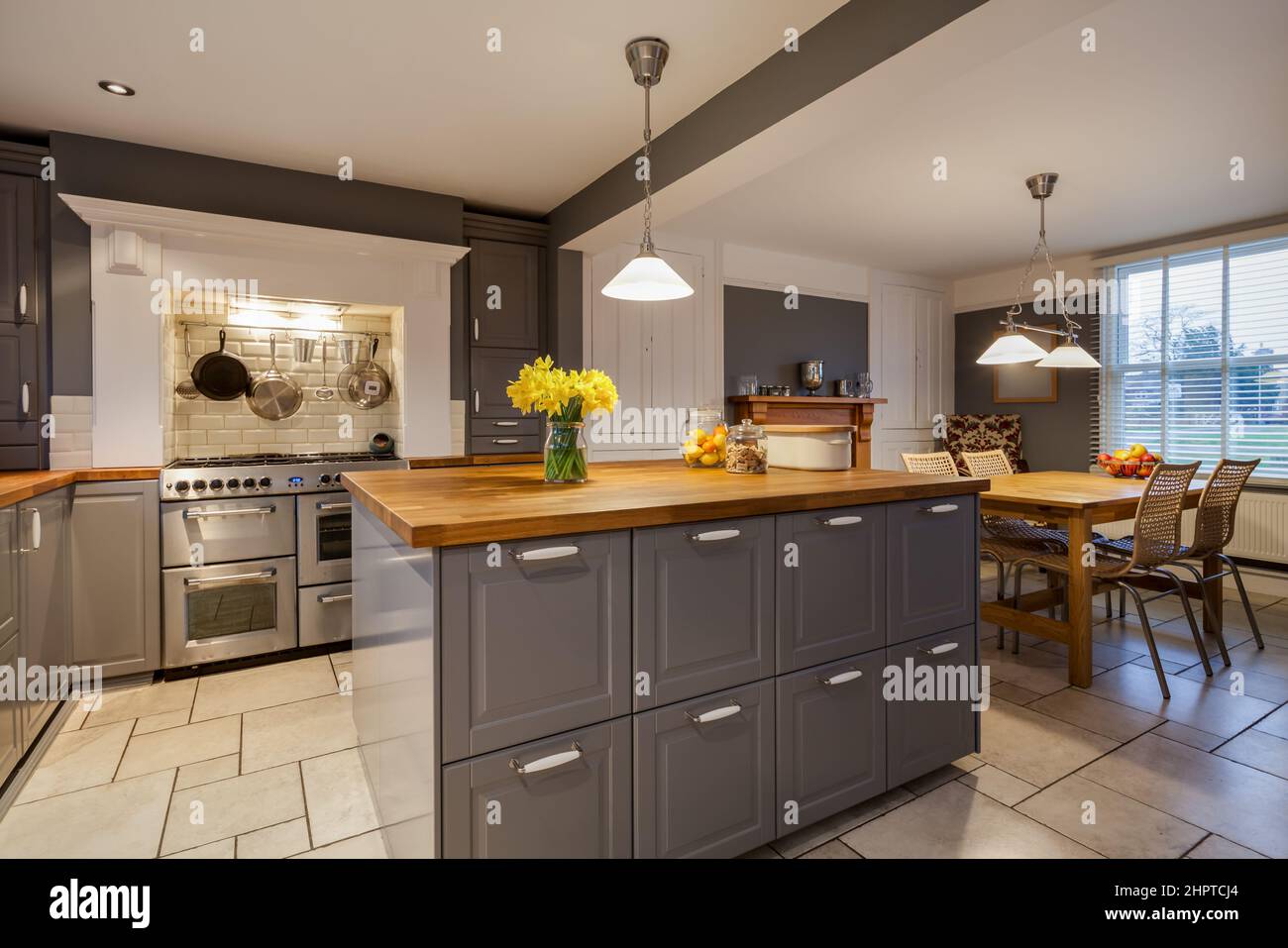 Modern kitchen with traditional looking built in cabinets in grey and ...