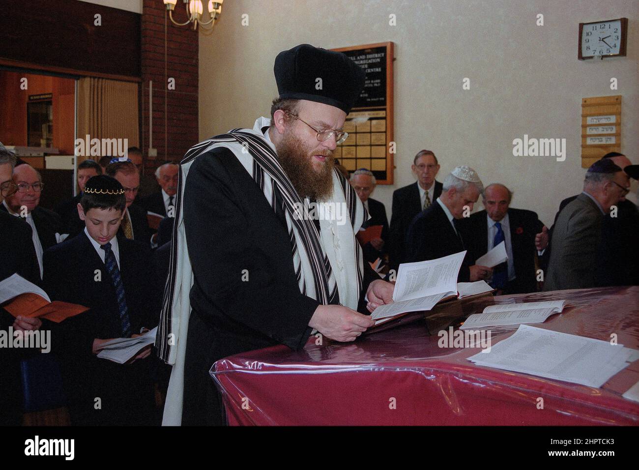 The chazan (cantor) leads weekday afternoon prayers. The Chief Rabbi ...