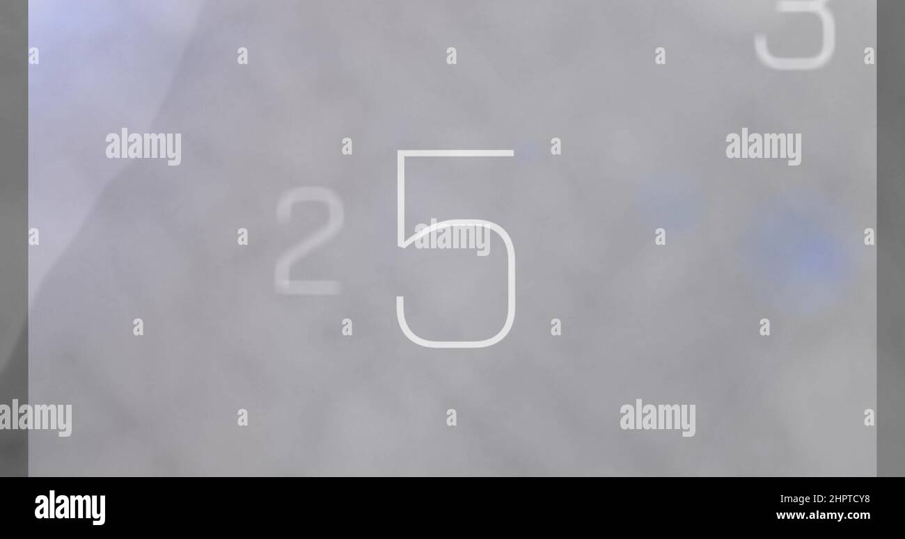Image of changing numbers over white background Stock Photo - Alamy