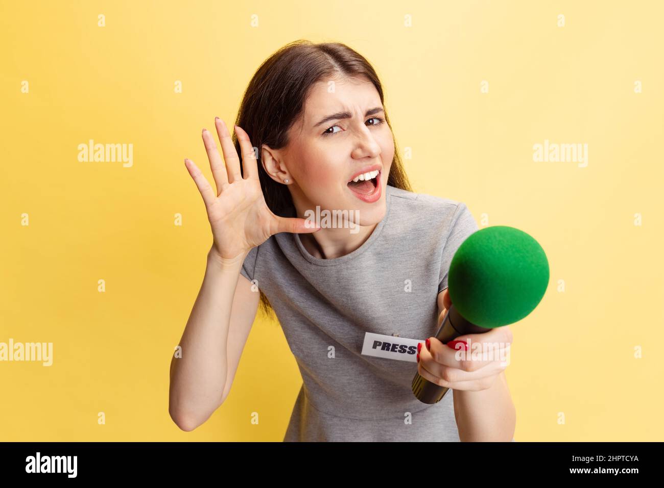 Emotional young girl, female press representative holding reporter ...