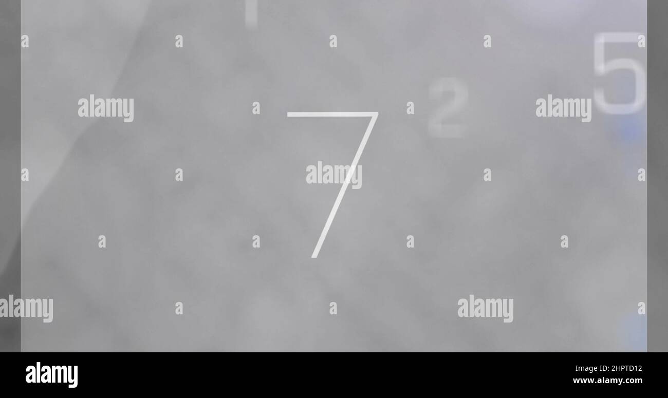 Image of changing numbers over white background Stock Photo - Alamy