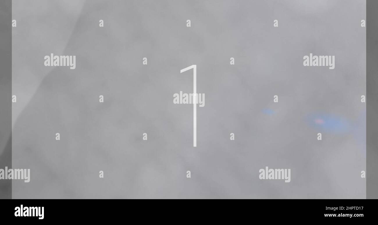 Image of changing numbers over white background Stock Photo - Alamy
