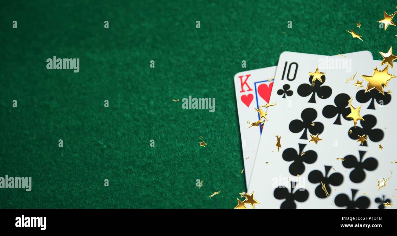 Image of moving stars over cards on green board Stock Photo - Alamy