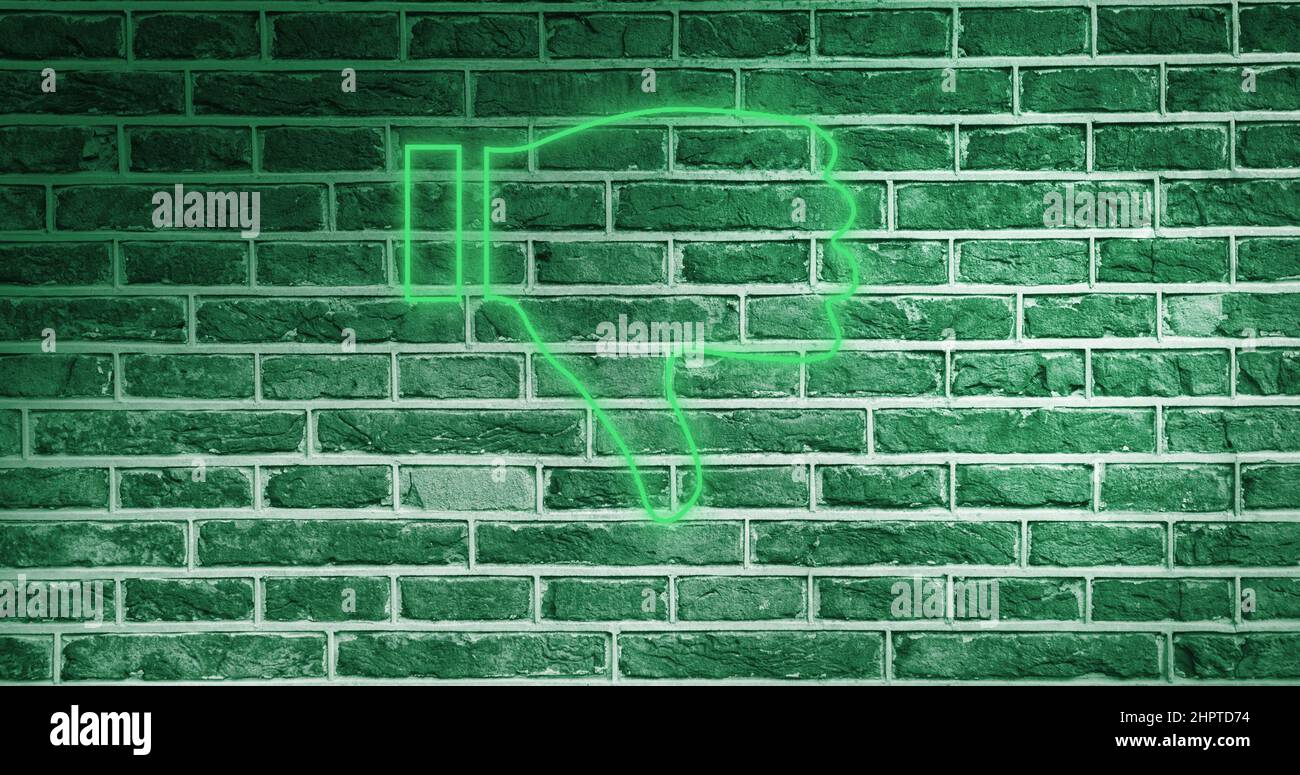 Image of glowing neon thumb down icon on brick wall Stock Photo - Alamy