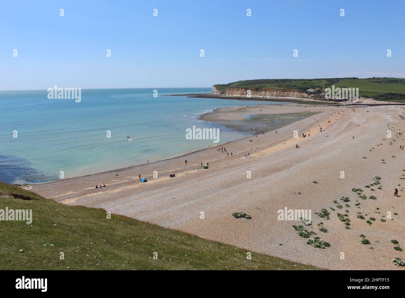 Cuckmere Haven Beach on a busy summers day with tourists. Seen against ...